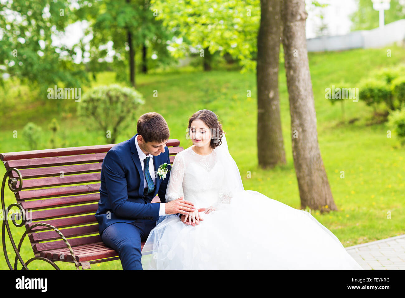 Bride and groom on the bench Stock Photo - Alamy
