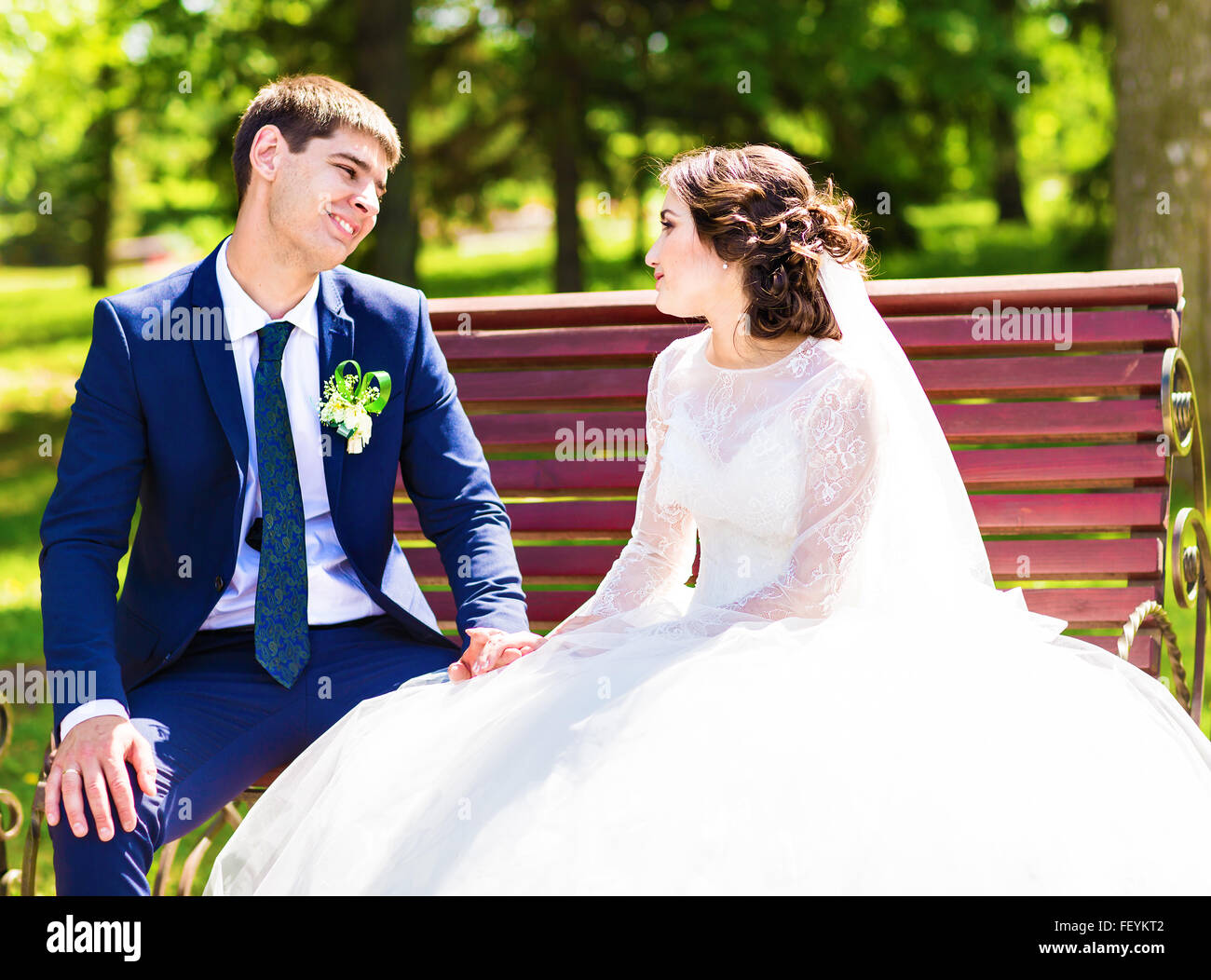 Bride and groom on the bench Stock Photo - Alamy