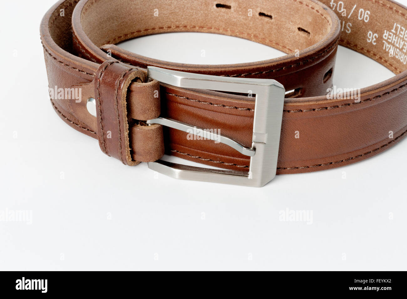 Brown leather belt isolated on white background Stock Photo - Alamy