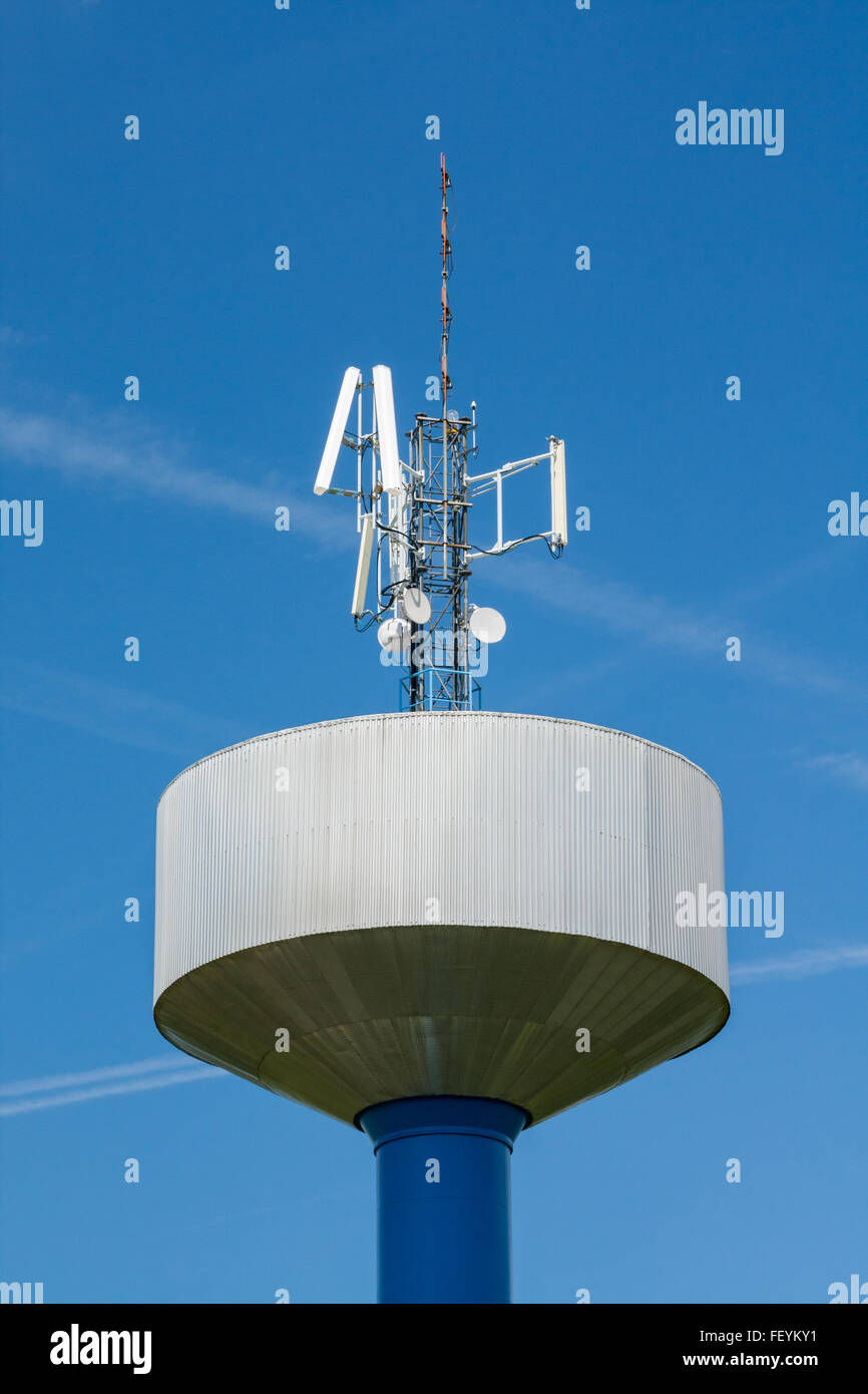 Modern Water Tower with Telecommunication Antennas, blue sky Stock ...
