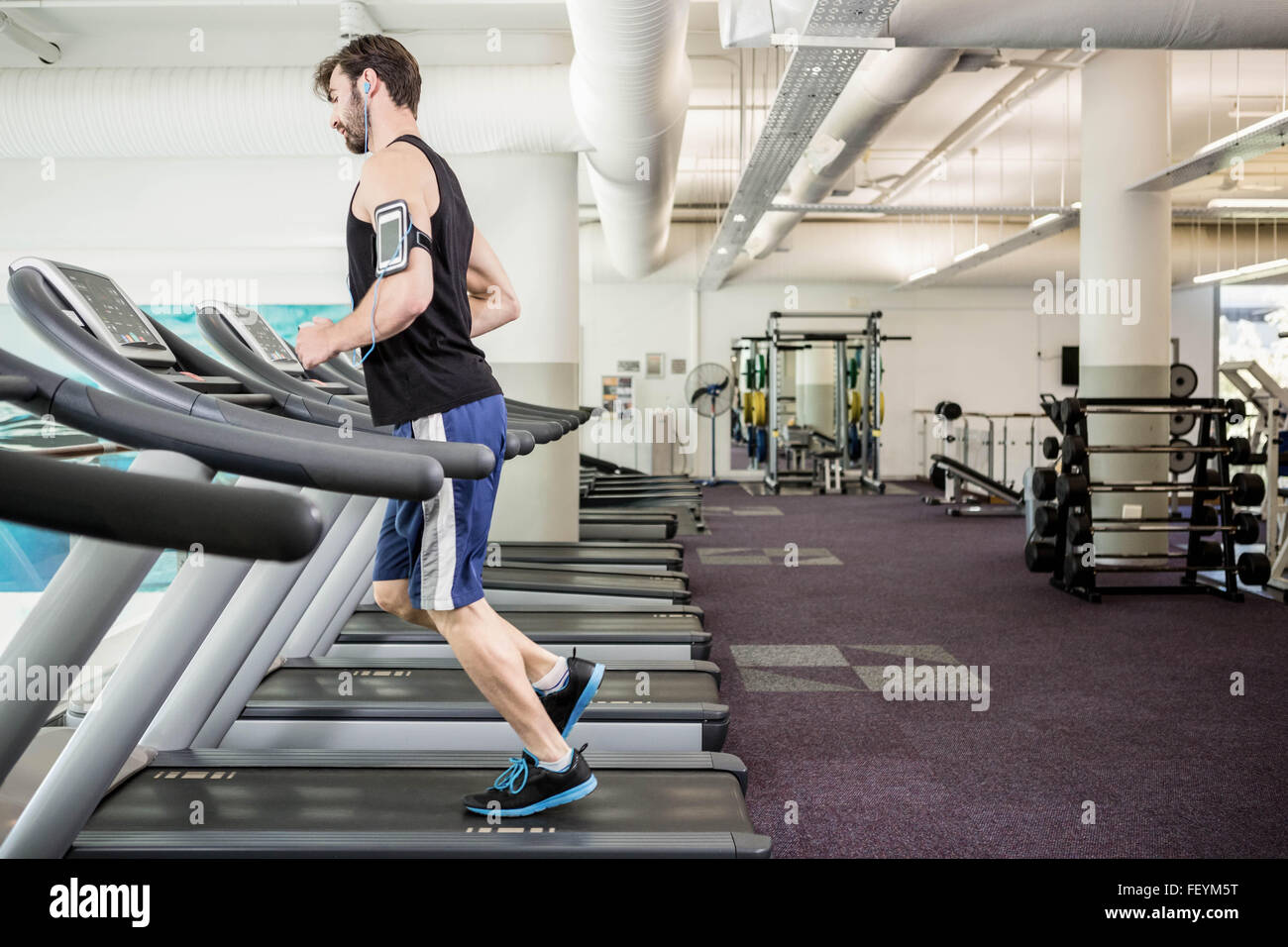Man running on treadmill Stock Photo - Alamy