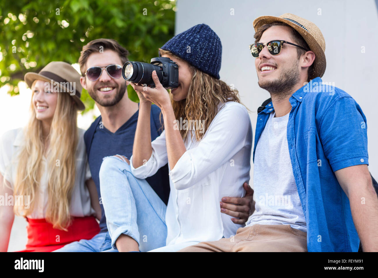 Woman taking pictures of friends hi-res stock photography and images ...