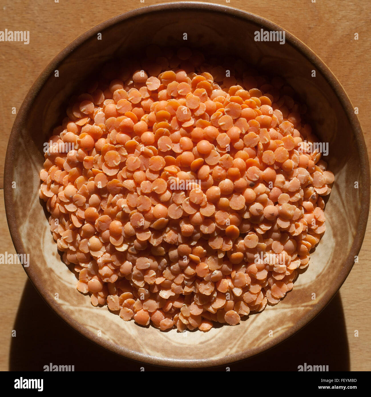 Pink lentils in wooden bowl Stock Photo - Alamy