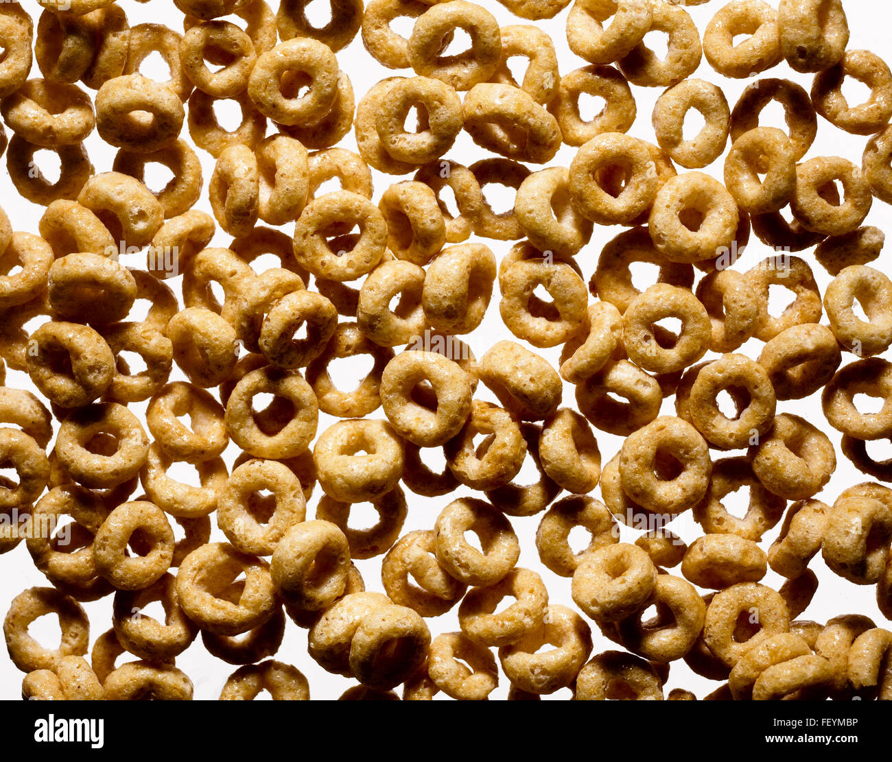 Circle shaped cereal pieces on white background Stock Photo - Alamy