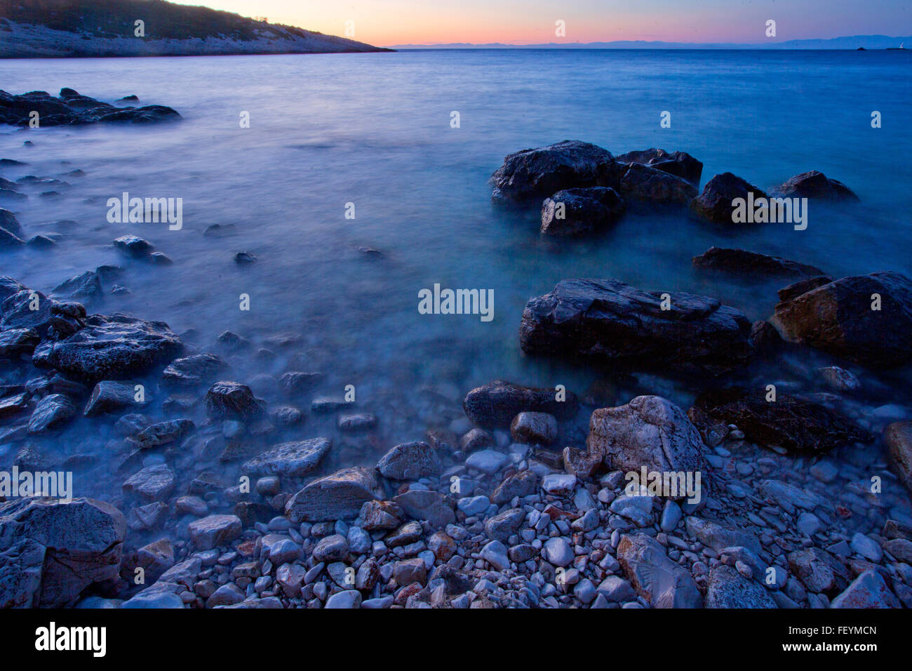 Waves at sunset on Vis island, Croatia Stock Photo - Alamy