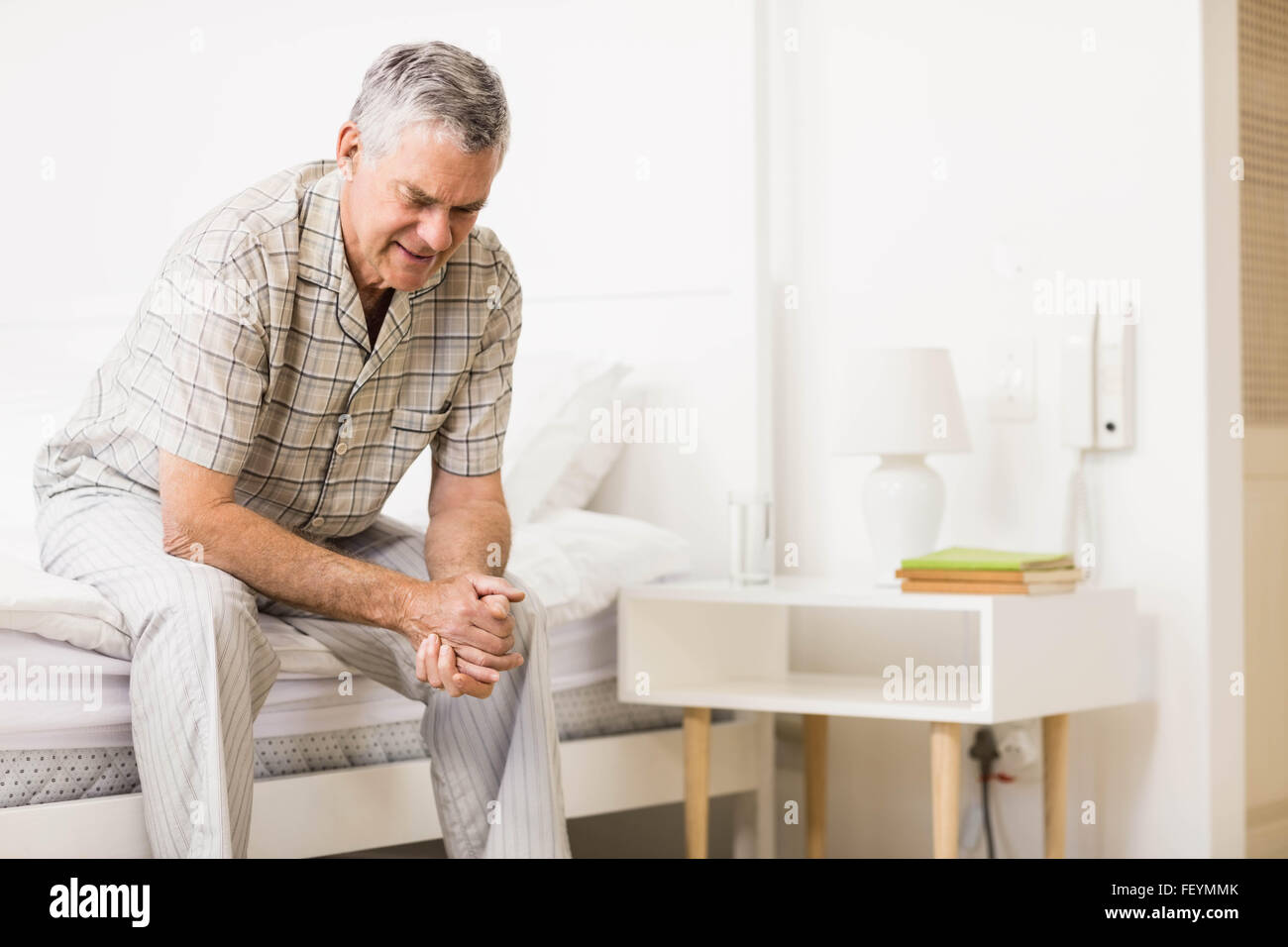 Suffering senior man waiting Stock Photo - Alamy
