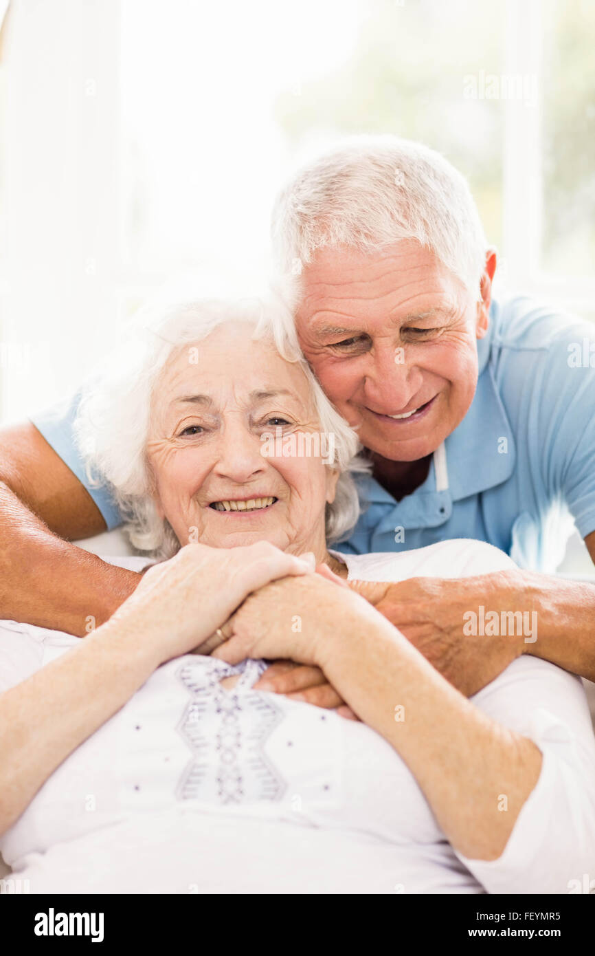 Cute senior couple hugging Stock Photo - Alamy