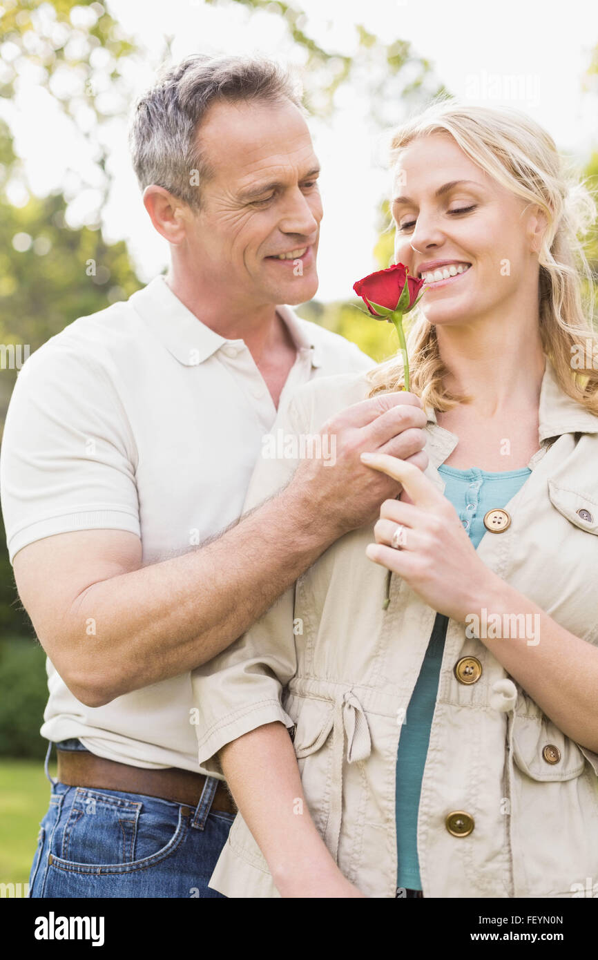 Husband offering a rose to wife Stock Photo - Alamy