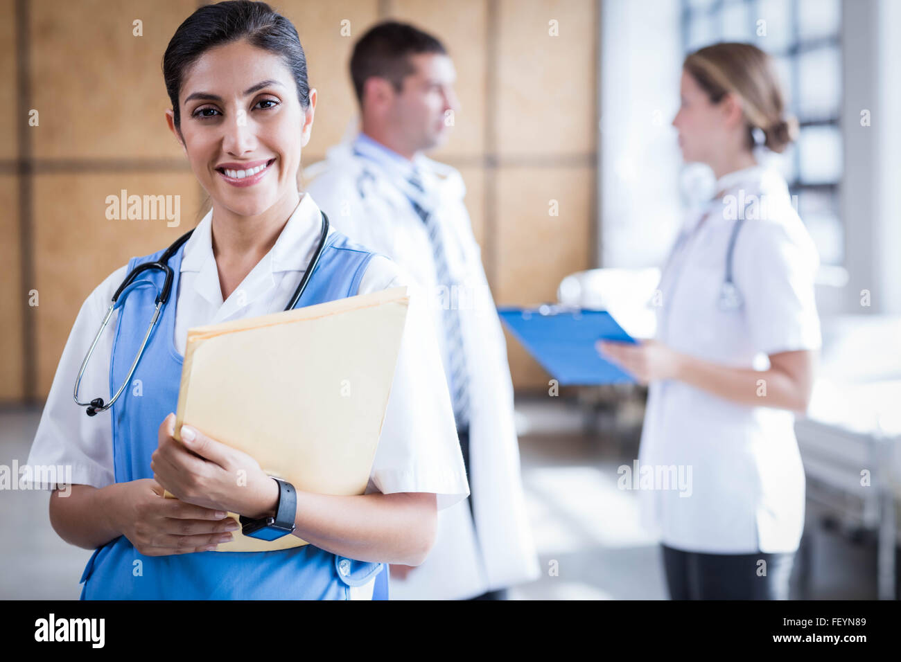 Nurse smiling at the camera Stock Photo - Alamy