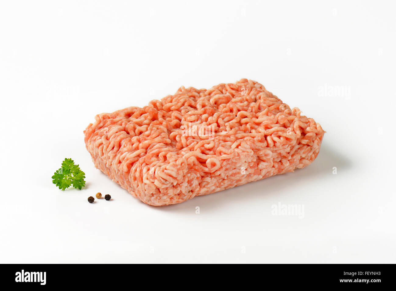 block of raw minced meat on white background Stock Photo - Alamy