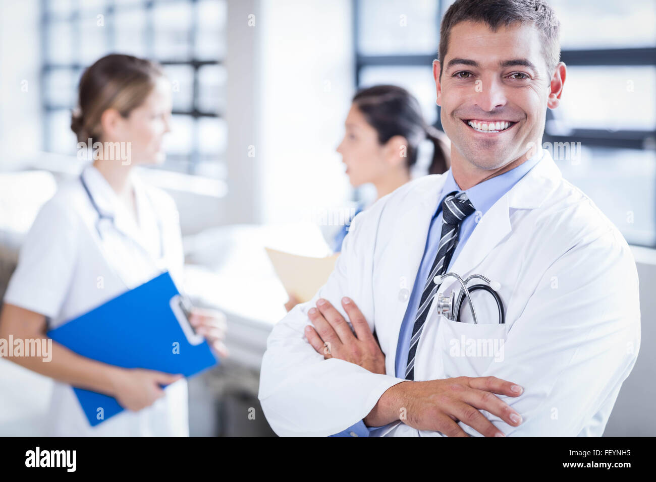 Doctor smiling at the camera Stock Photo - Alamy