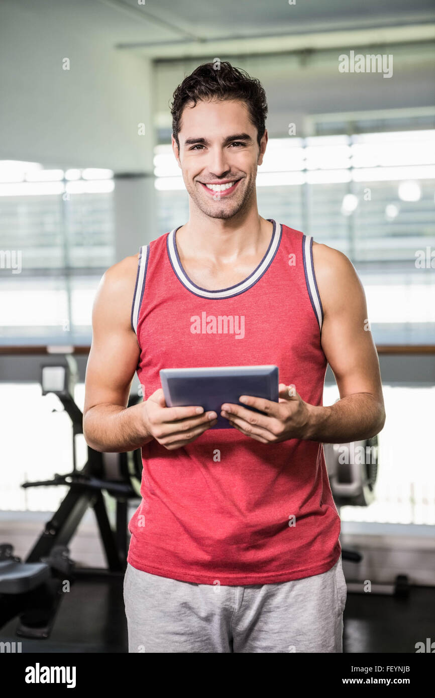 Smiling man holding tablet Stock Photo - Alamy