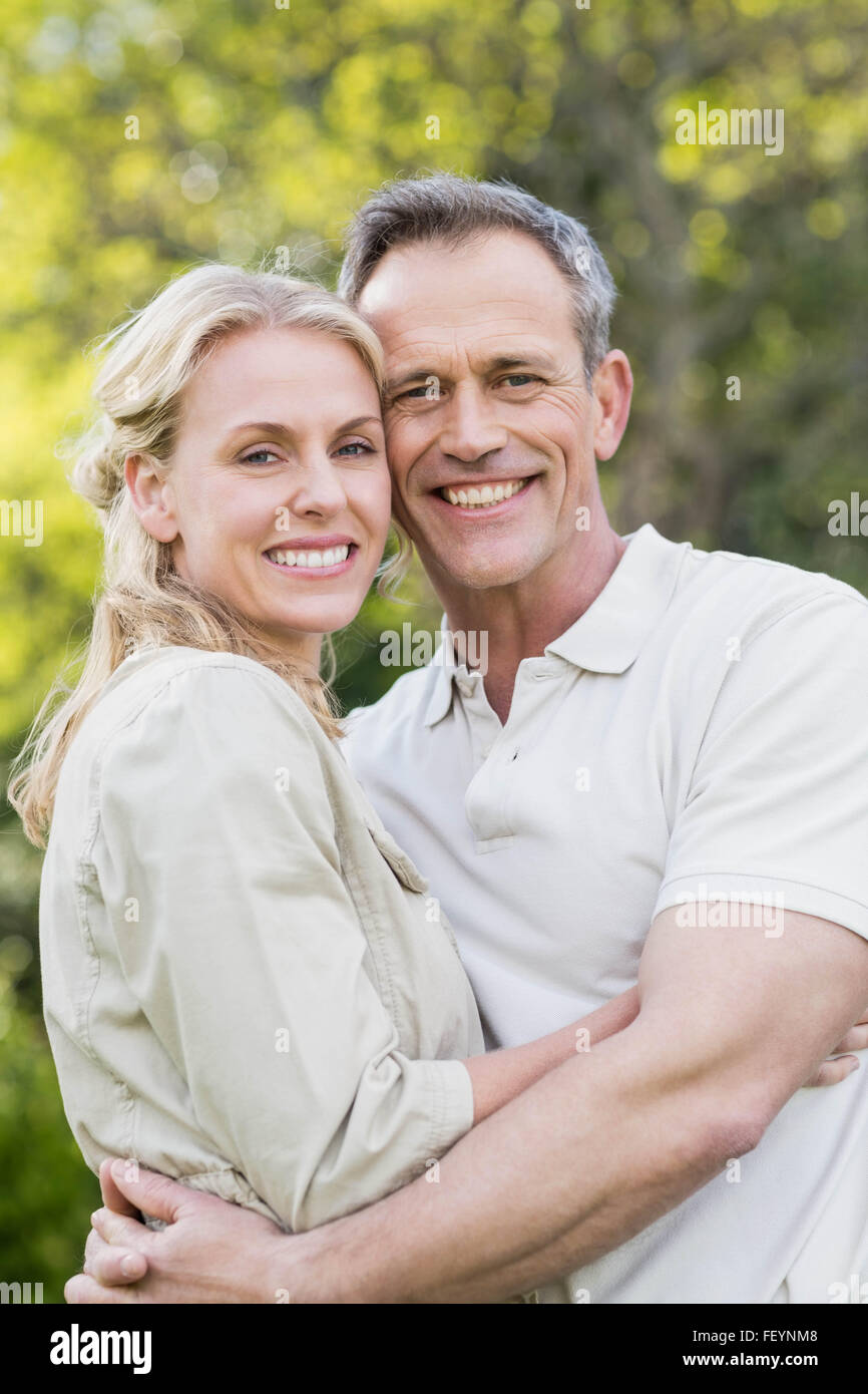 Couple hug arms hi-res stock photography and images - Alamy