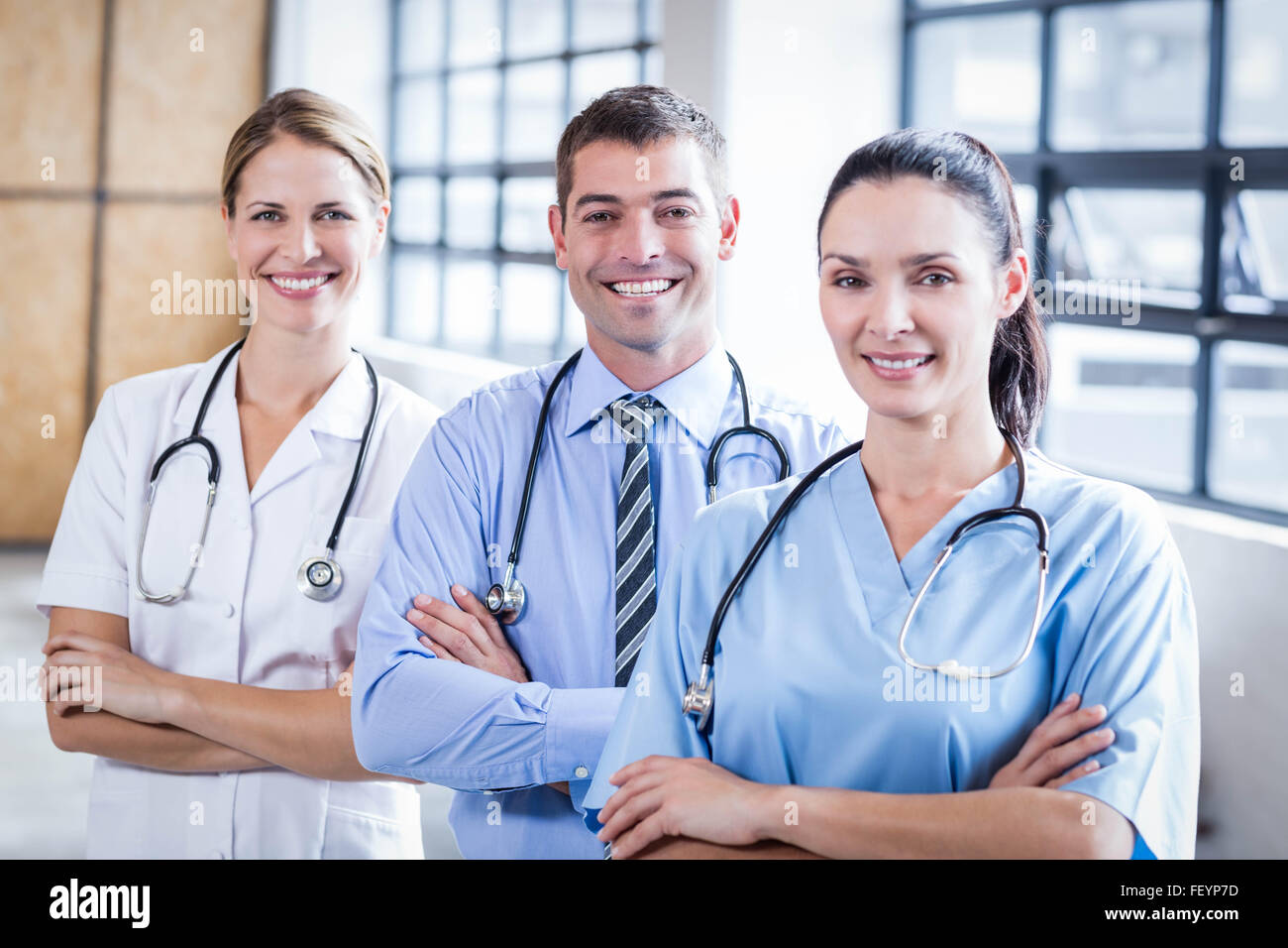 Medical team smiling camera together hi-res stock photography and ...