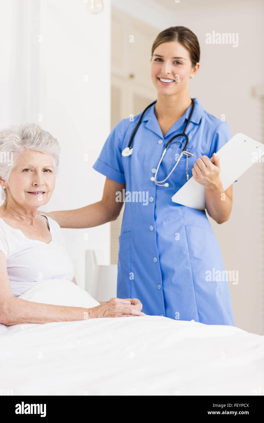 Doctor taking care of suffering senior patient Stock Photo - Alamy