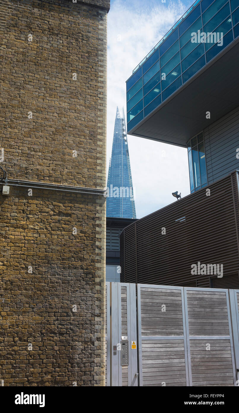 Top of the Shard seen between some older buildings Stock Photo - Alamy