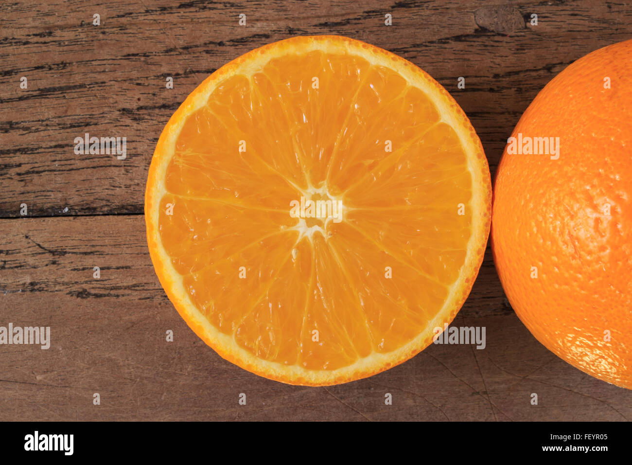 orange on the wood table Stock Photo - Alamy
