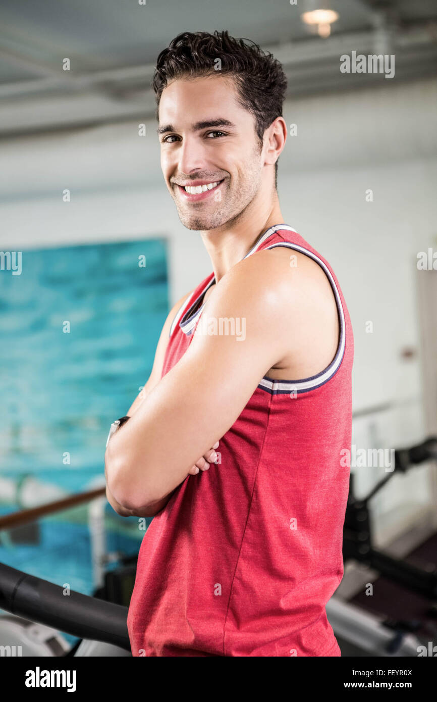 Smiling man with arms crossed Stock Photo - Alamy