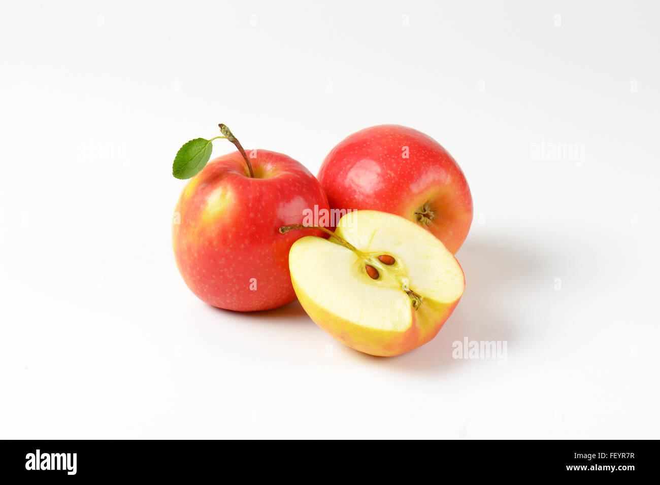two and a half apples on white background Stock Photo - Alamy