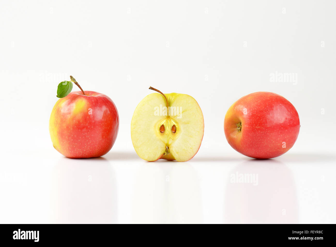 two and a half apples on white background Stock Photo - Alamy