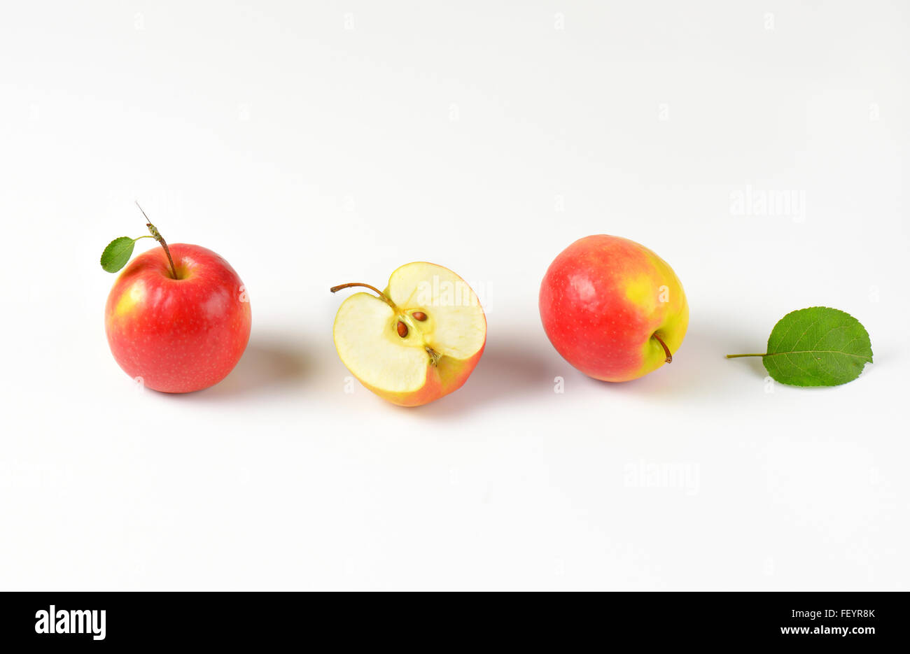 two and a half apples on white background Stock Photo - Alamy