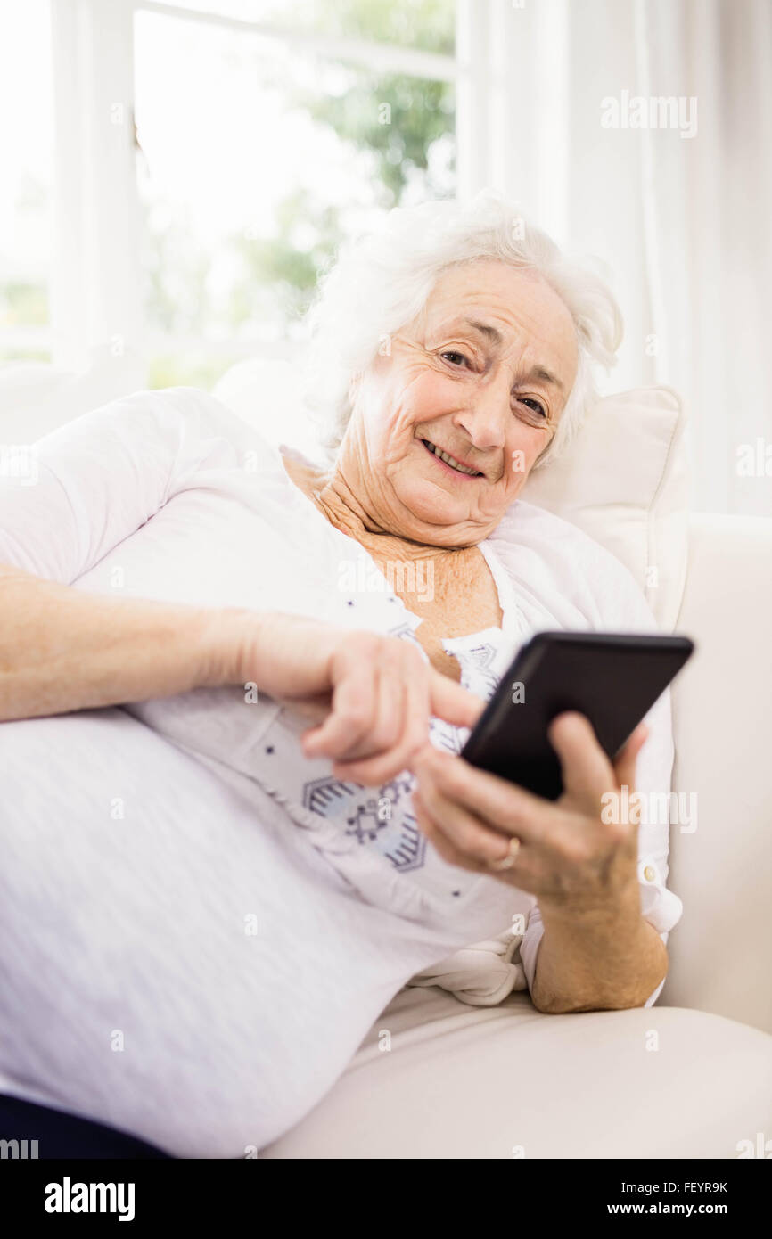 Elderly woman using her smartphone Stock Photo - Alamy