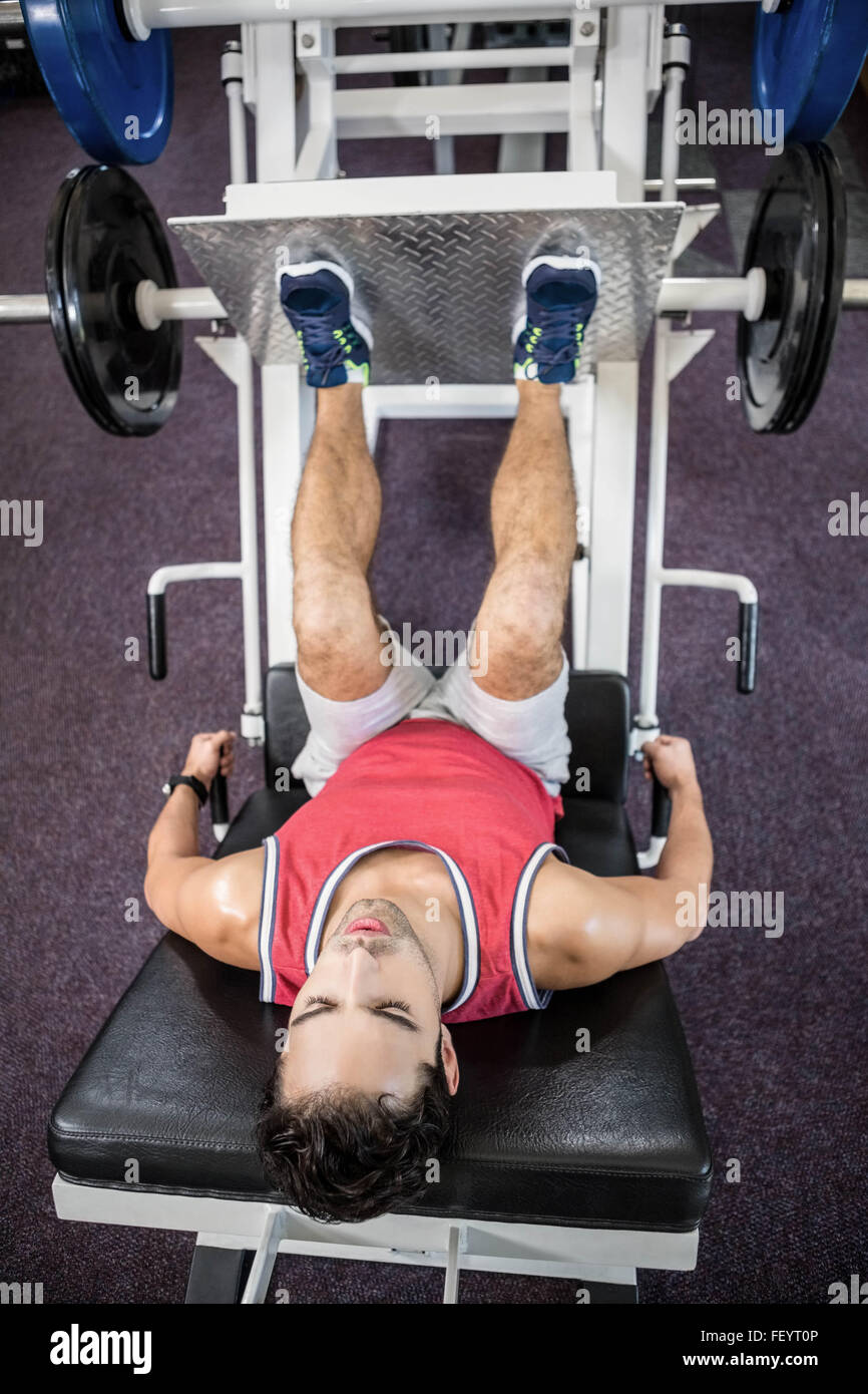 Muscular man doing exercise for legs Stock Photo - Alamy