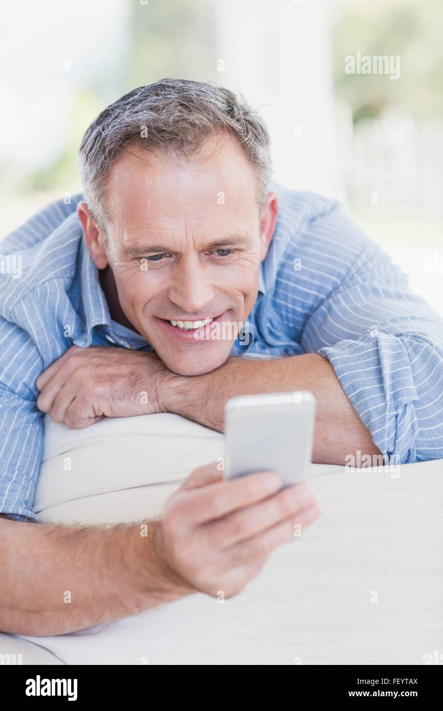 Happy man using smartphone Stock Photo - Alamy