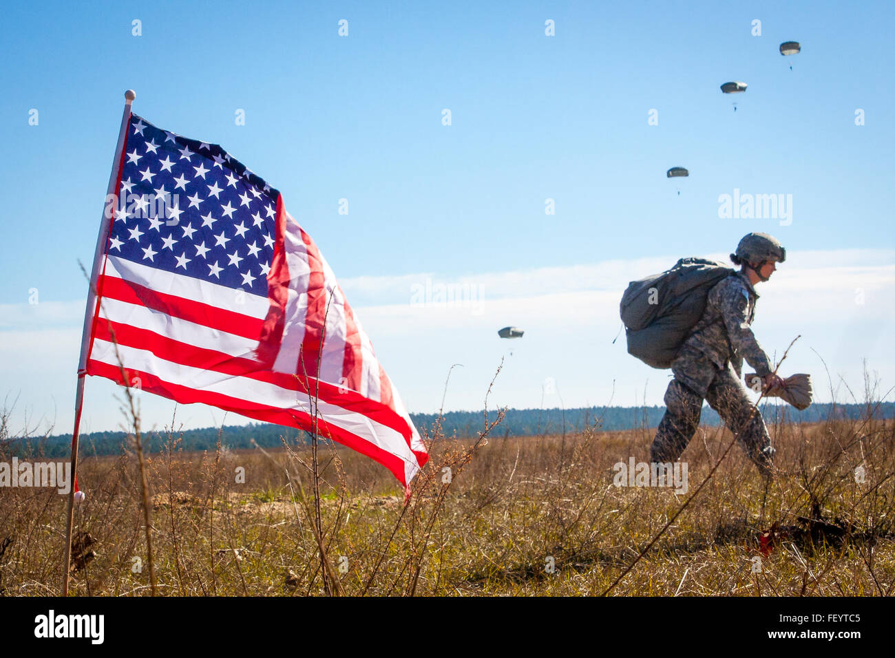 A female paratrooper assigned to the 82nd Airborne Division returns ...