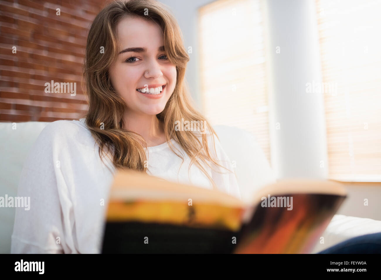Woman book smiling hi-res stock photography and images - Alamy