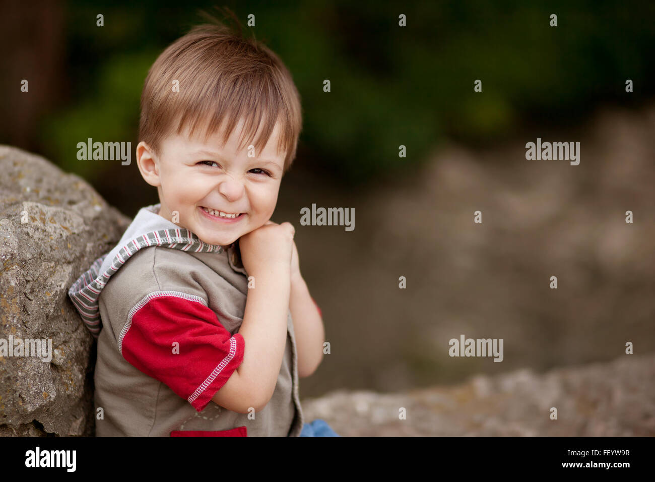Smiling shy boy Stock Photo - Alamy
