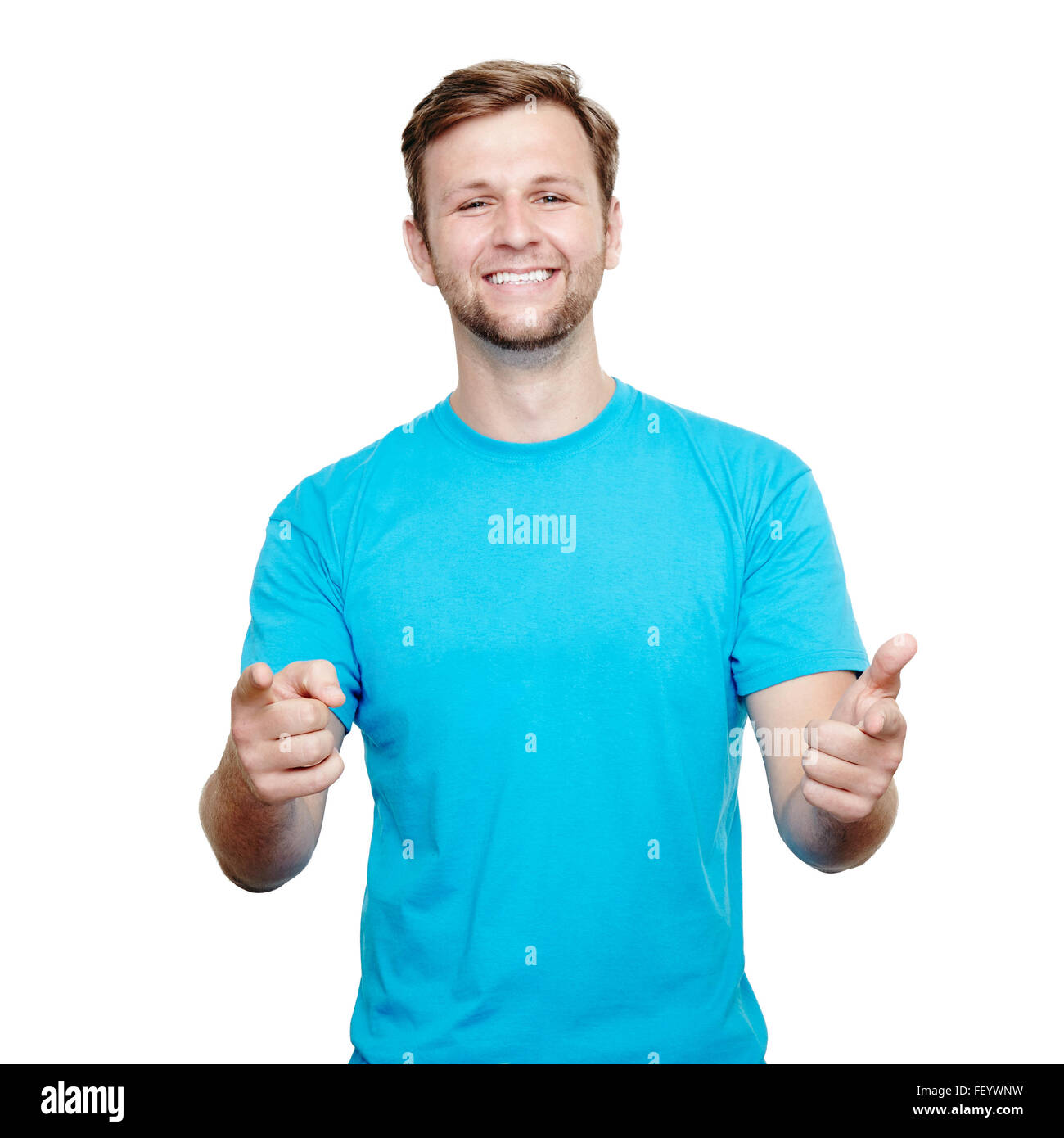 Smiling young man pointing at camera Stock Photo - Alamy