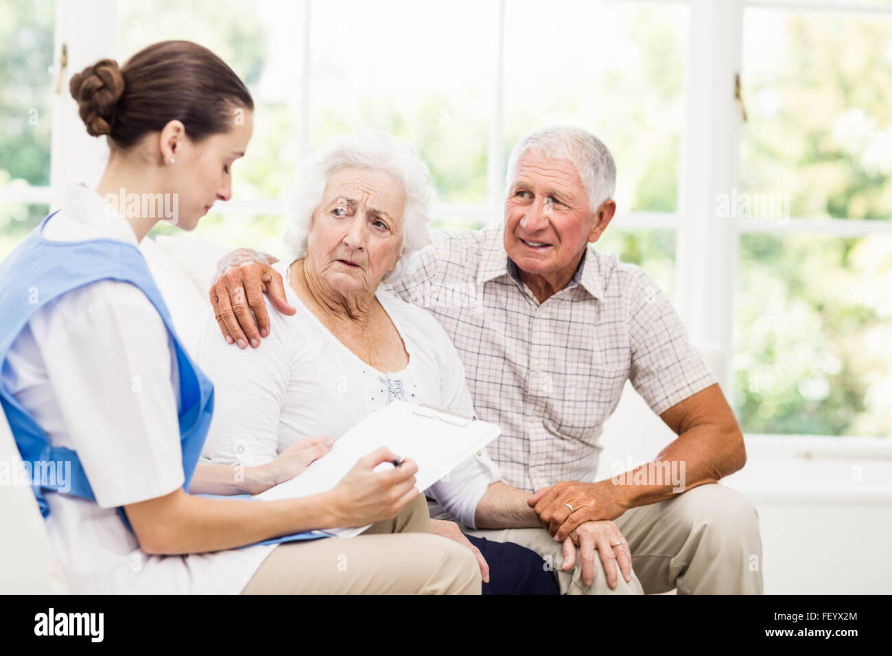 Nurse taking care of sick elderly patients Stock Photo - Alamy