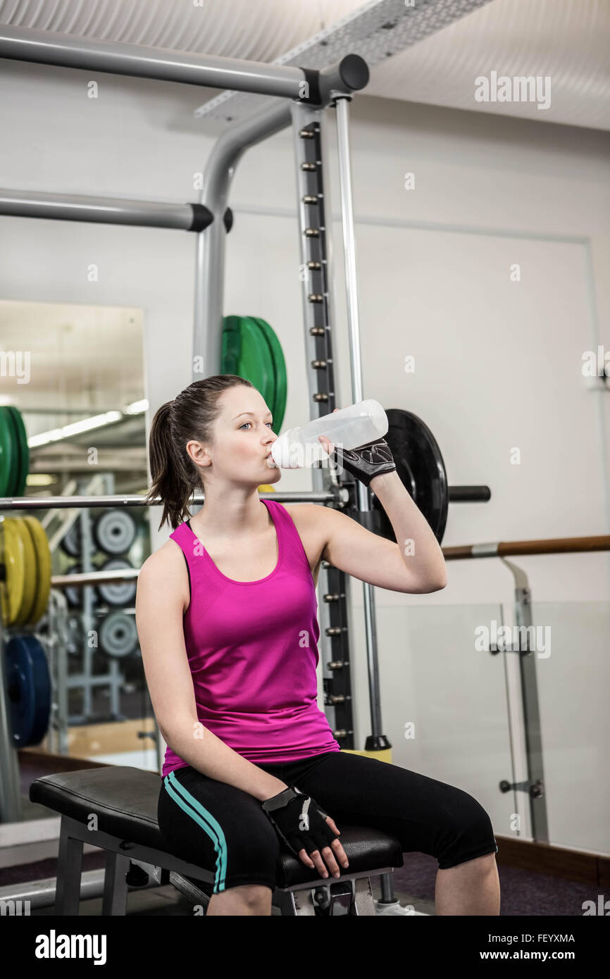 Fit woman drinking water Stock Photo - Alamy