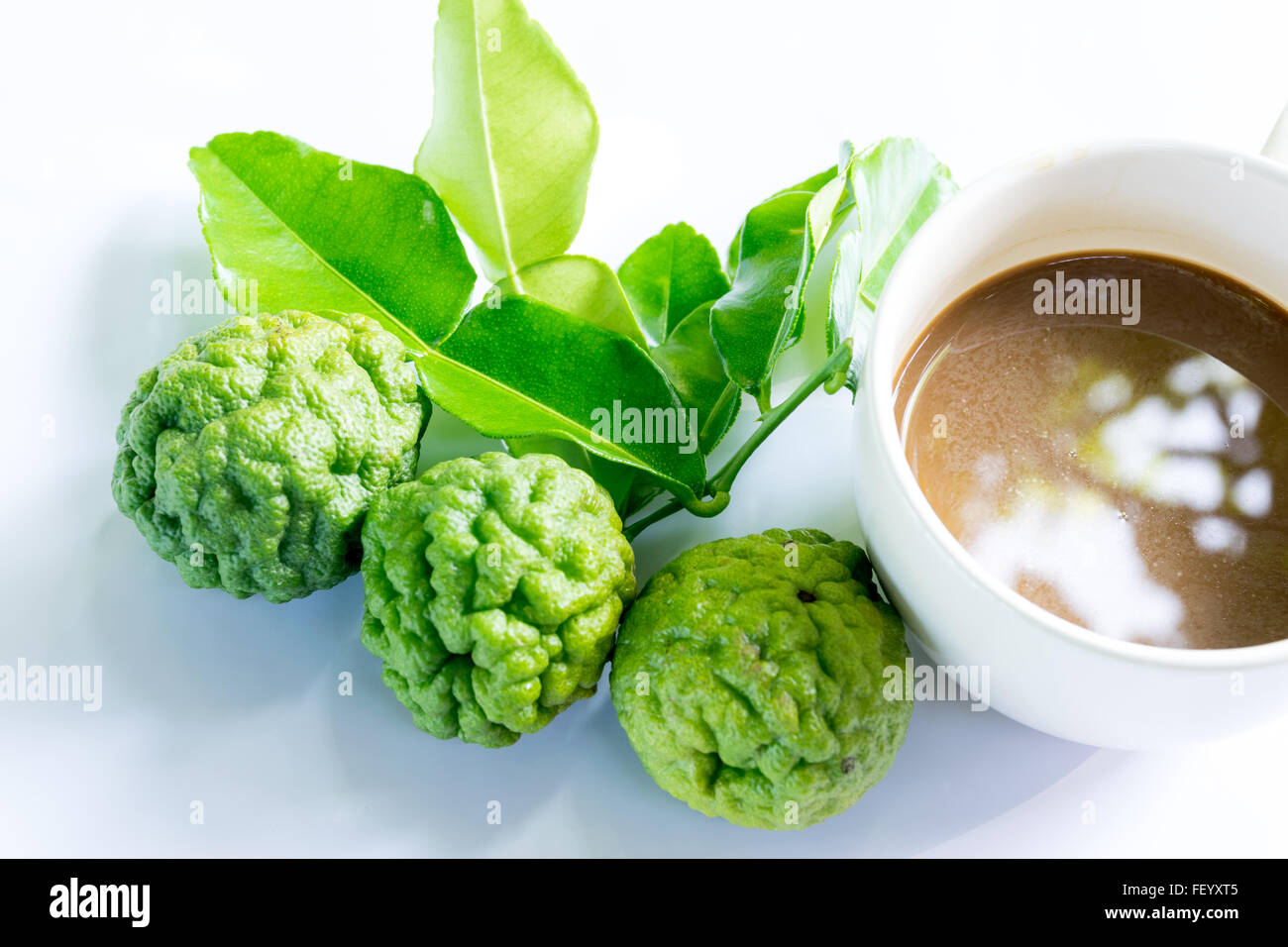 Kaffir lime leaves isolated on white background Stock Photo - Alamy