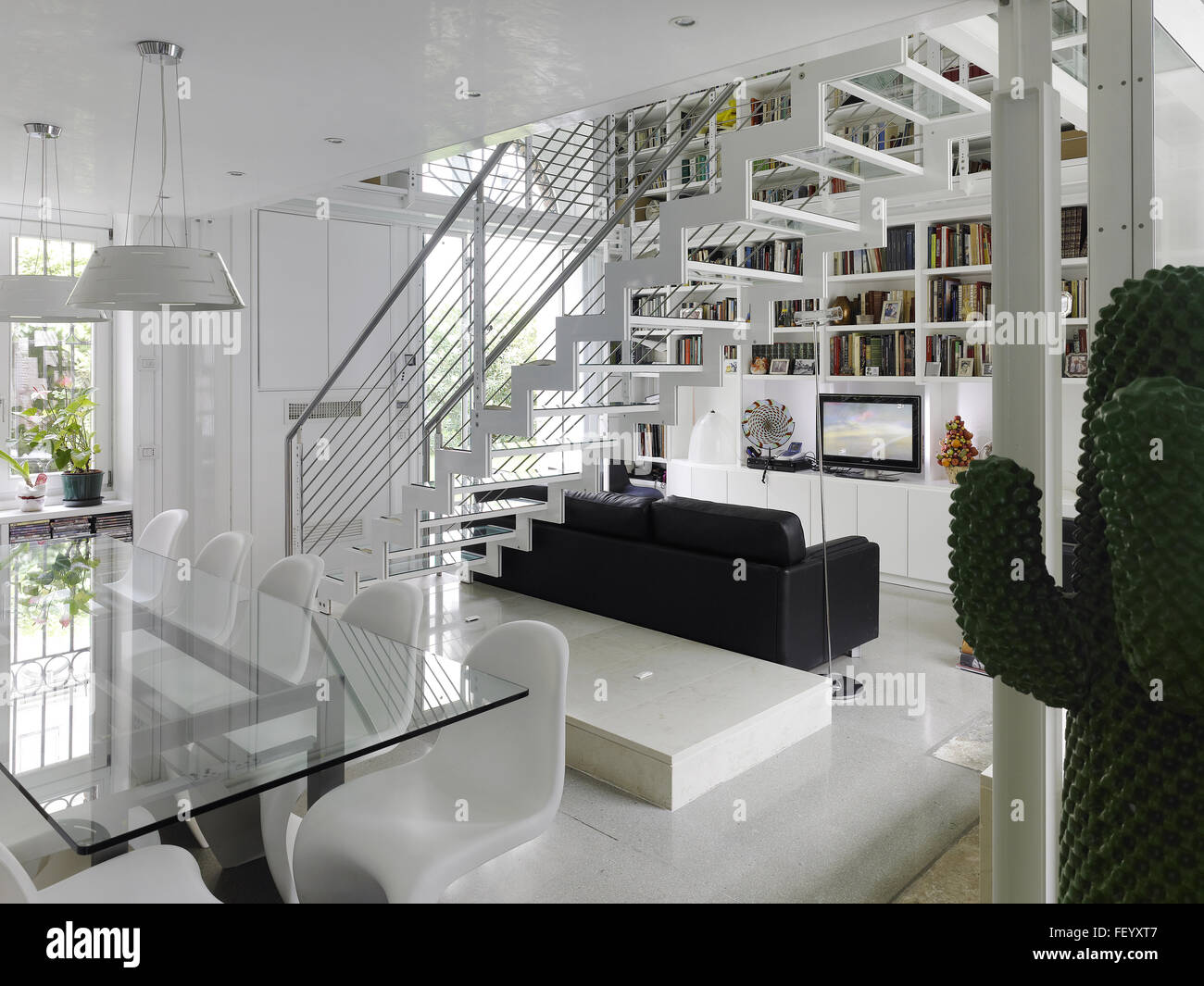 Contemporary loft studio with white wall and white furnitures Stock ...