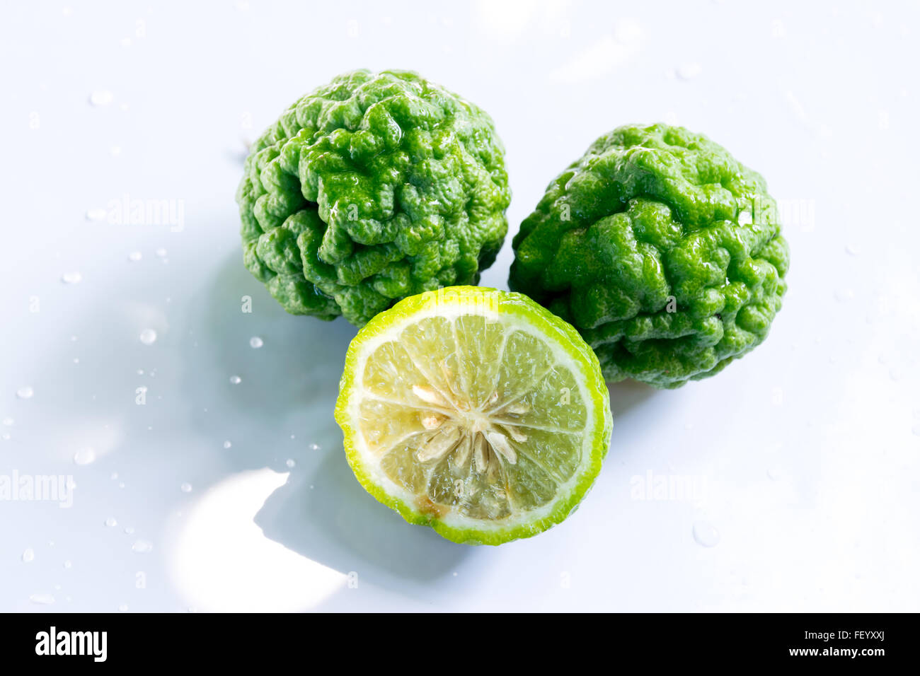 Kaffir lime leaves isolated on white background Stock Photo - Alamy