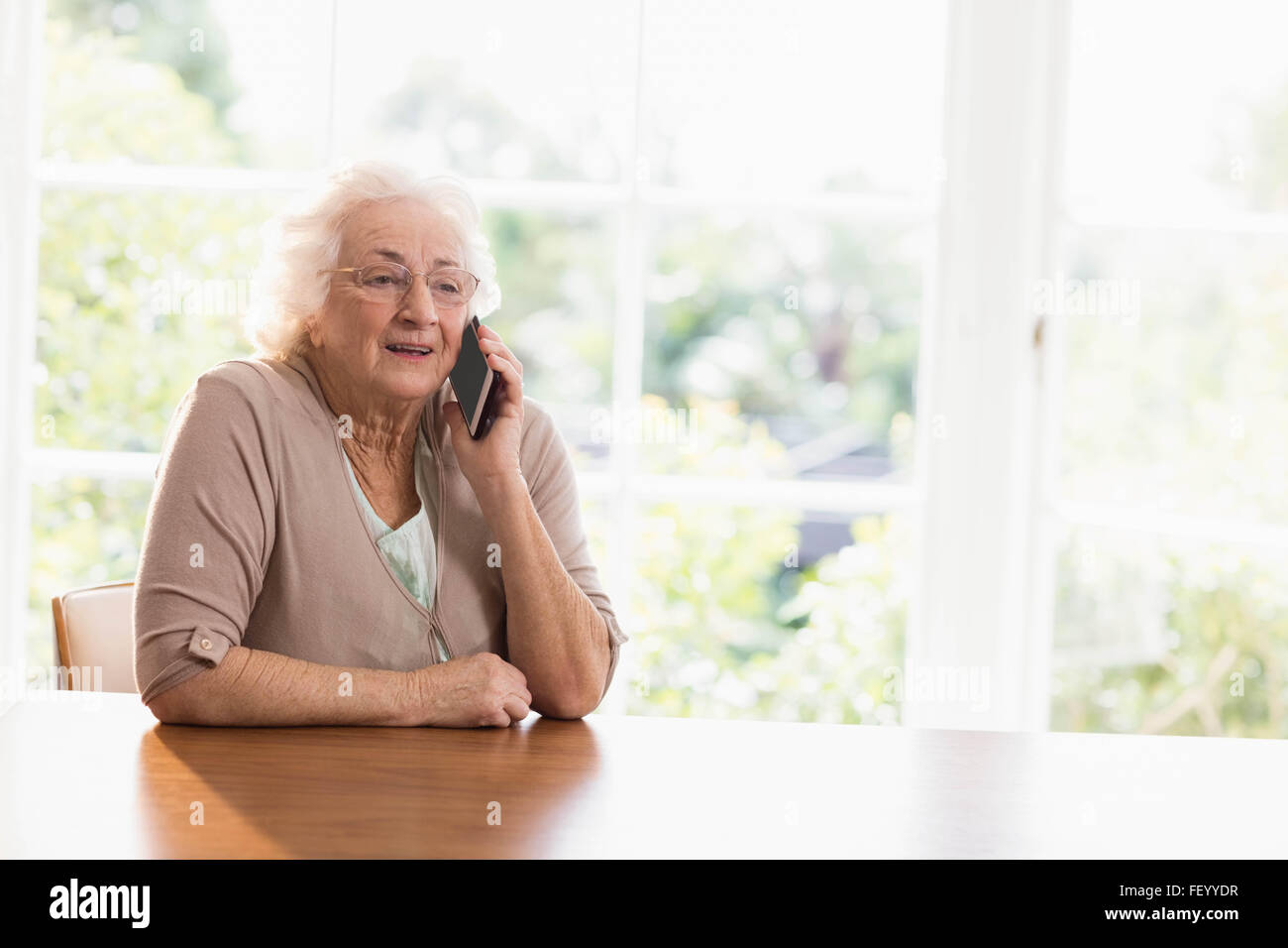 Smiling elderly woman phone calling Stock Photo - Alamy