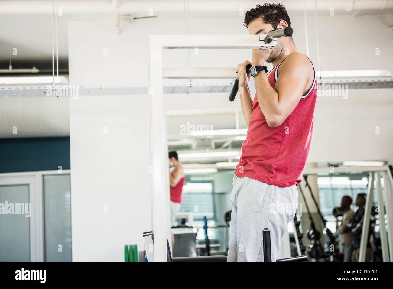 Muscular man doing pull up Stock Photo - Alamy