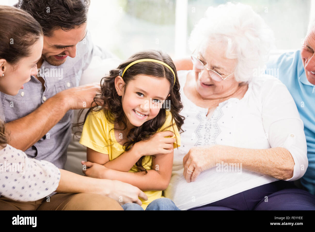 Happy extended family smiling Stock Photo - Alamy