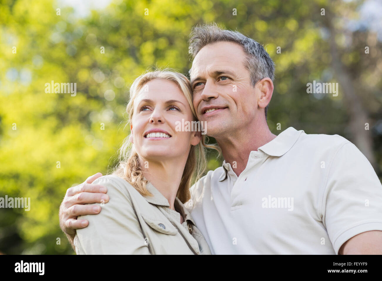 Cute couple looking in the same direction Stock Photo - Alamy