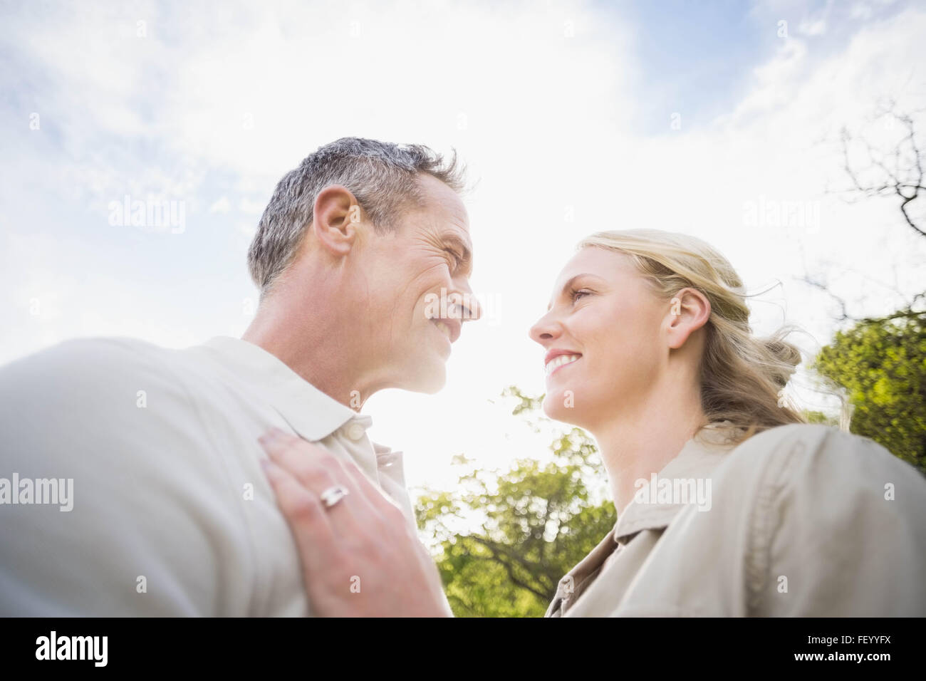 Cute couple smiling at each other Stock Photo - Alamy