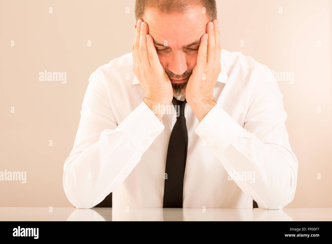 Business man depression and burn out white background Stock Photo - Alamy