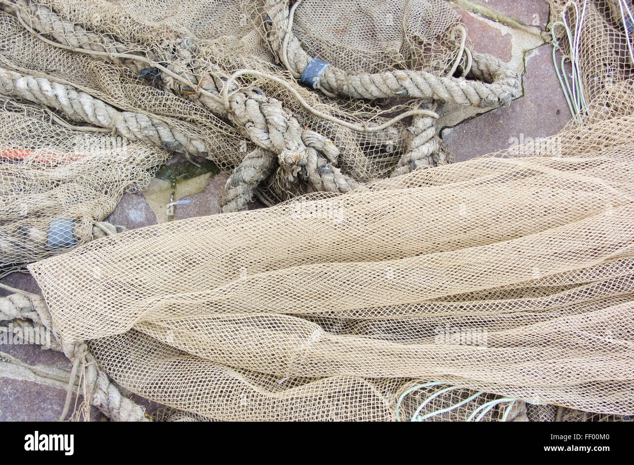 Used fishing net with floaters Stock Photo - Alamy