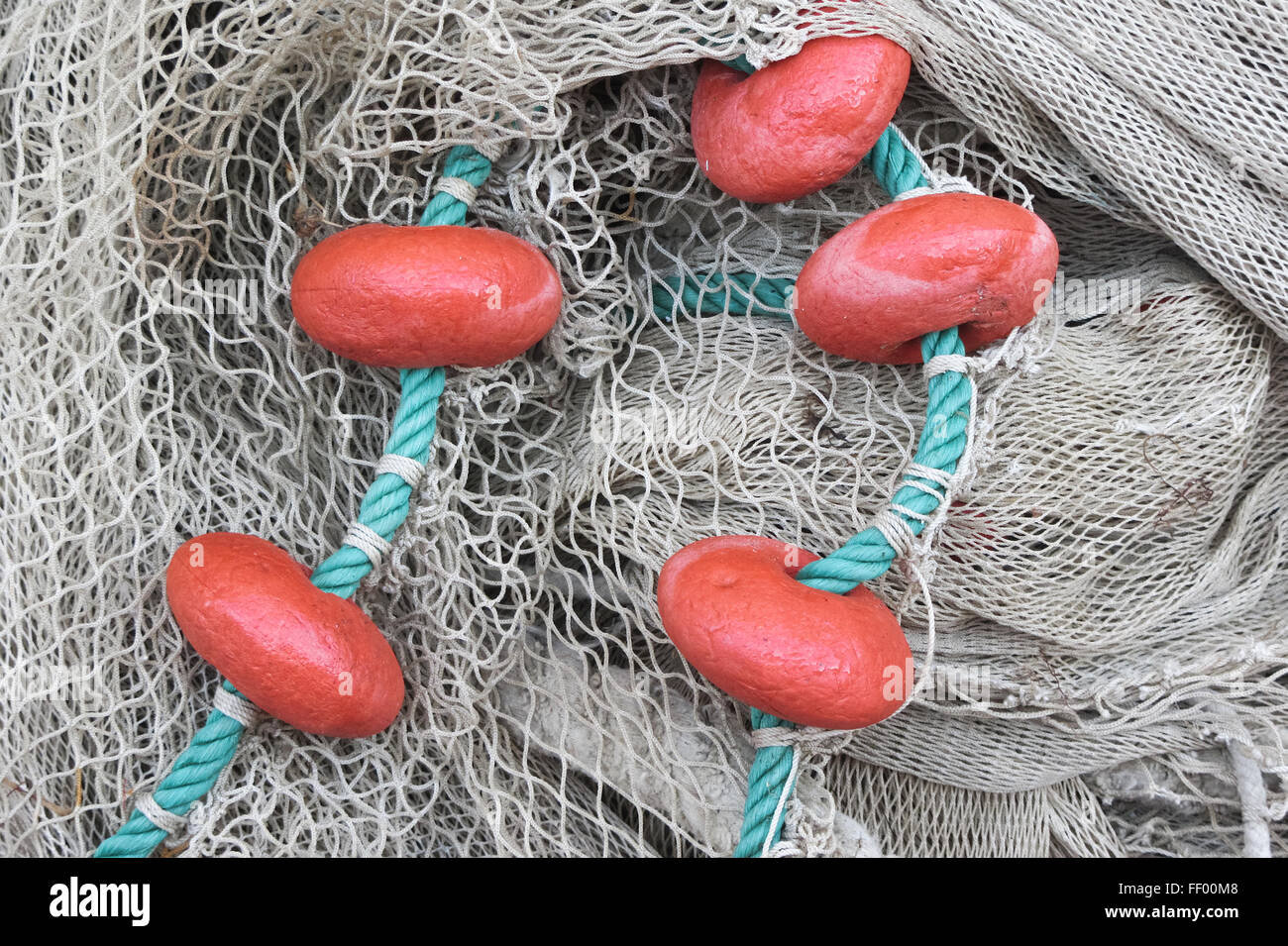 Used fishing net with floaters Stock Photo - Alamy