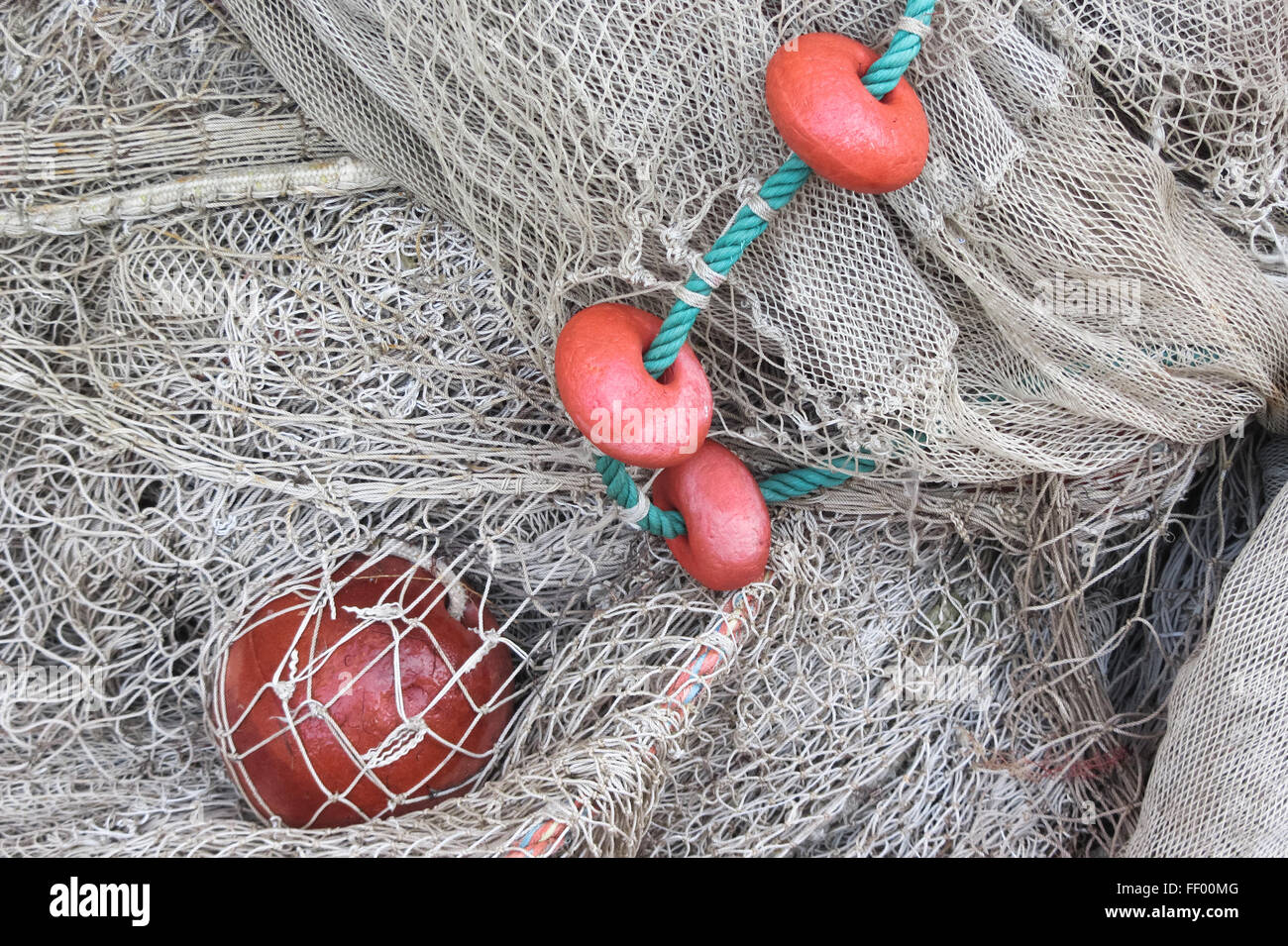 Used fishing net with floaters Stock Photo - Alamy