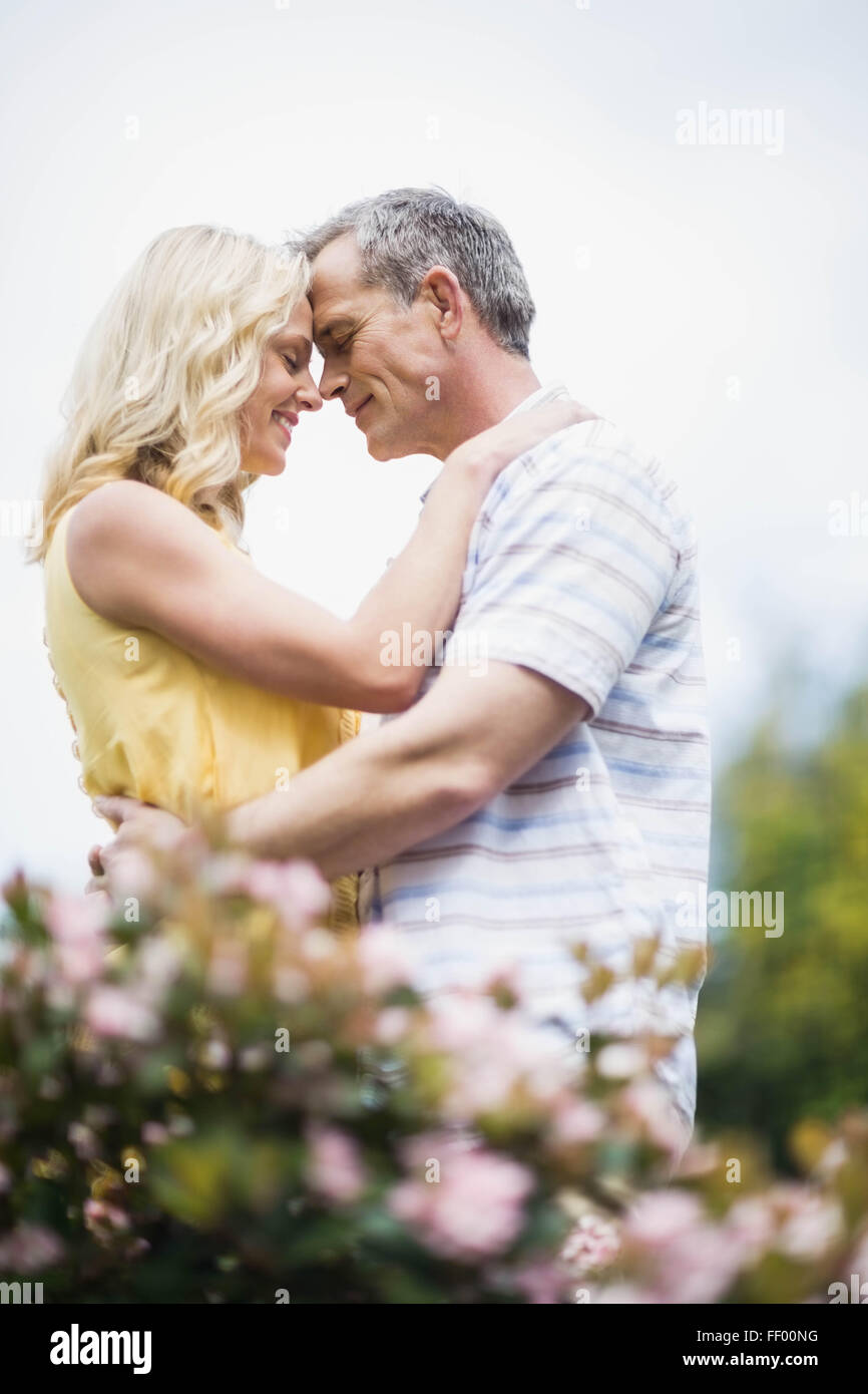 Happy couple hugging Stock Photo - Alamy