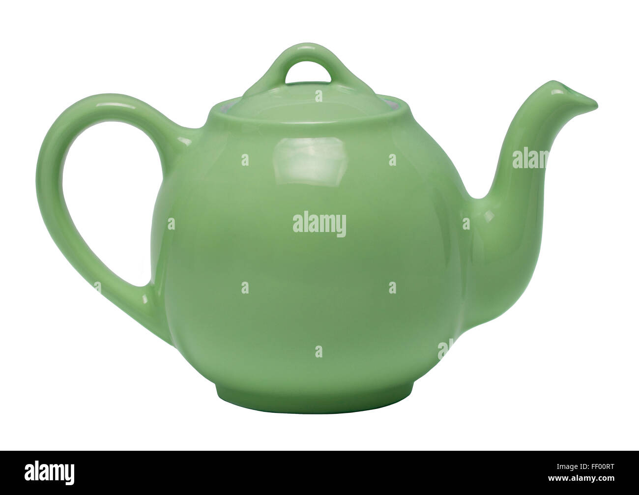 Green teapot isolated against a white background Stock Photo - Alamy
