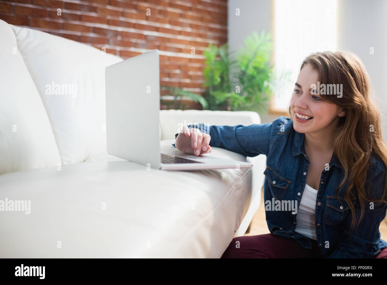 Pretty woman sitting hi-res stock photography and images - Alamy