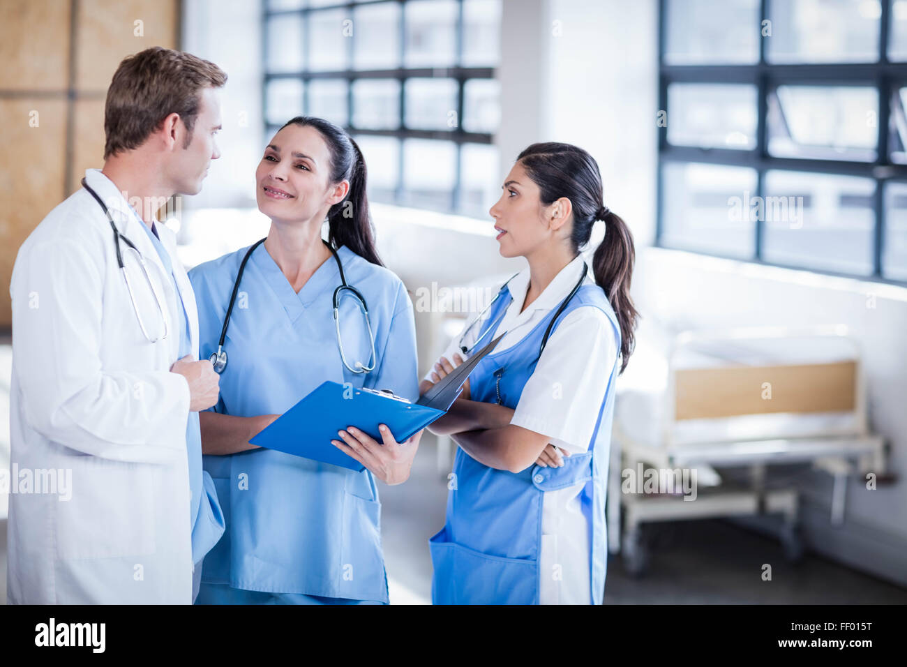 Medical team discussing the report together Stock Photo - Alamy